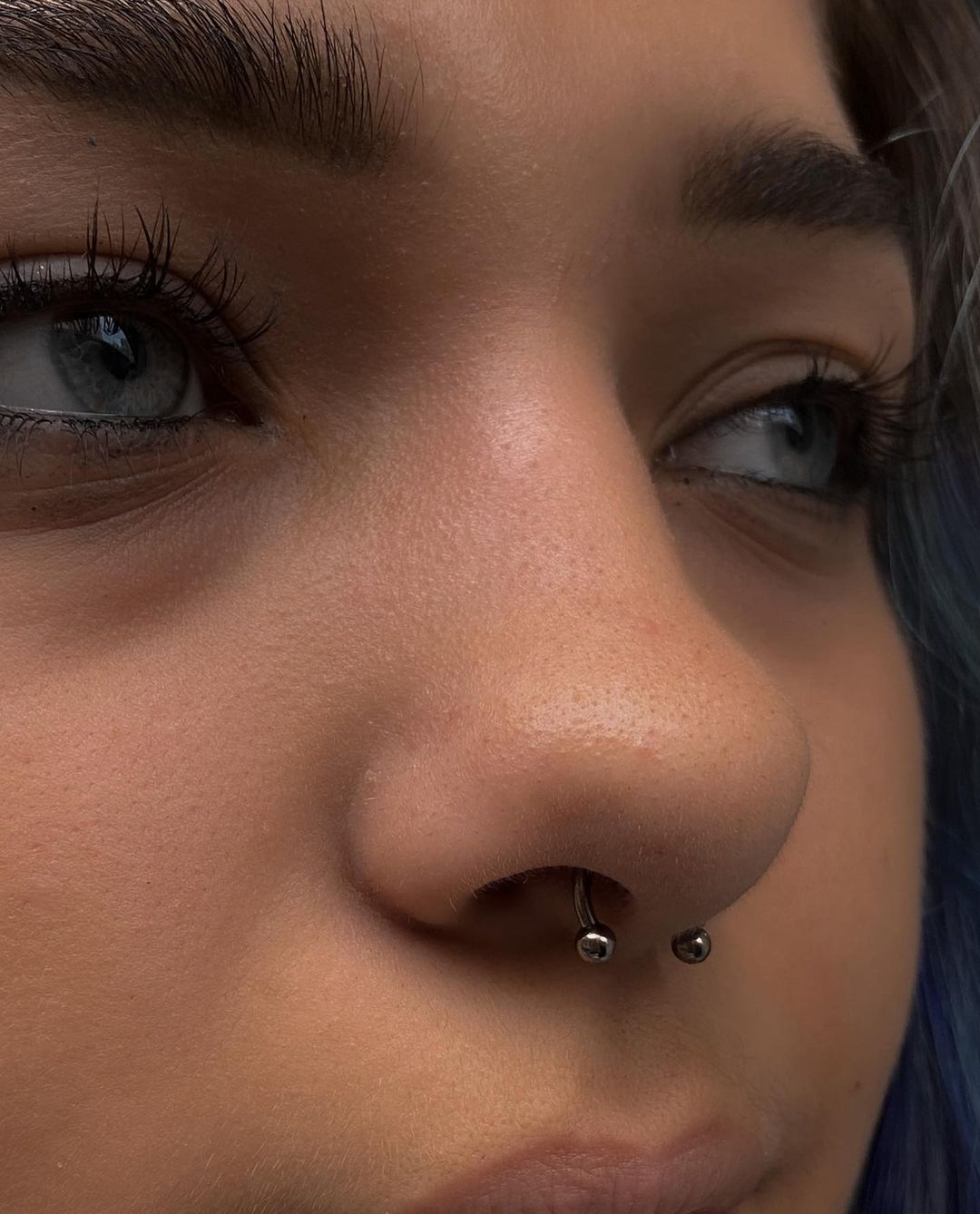 Double Nose And Septum Piercing